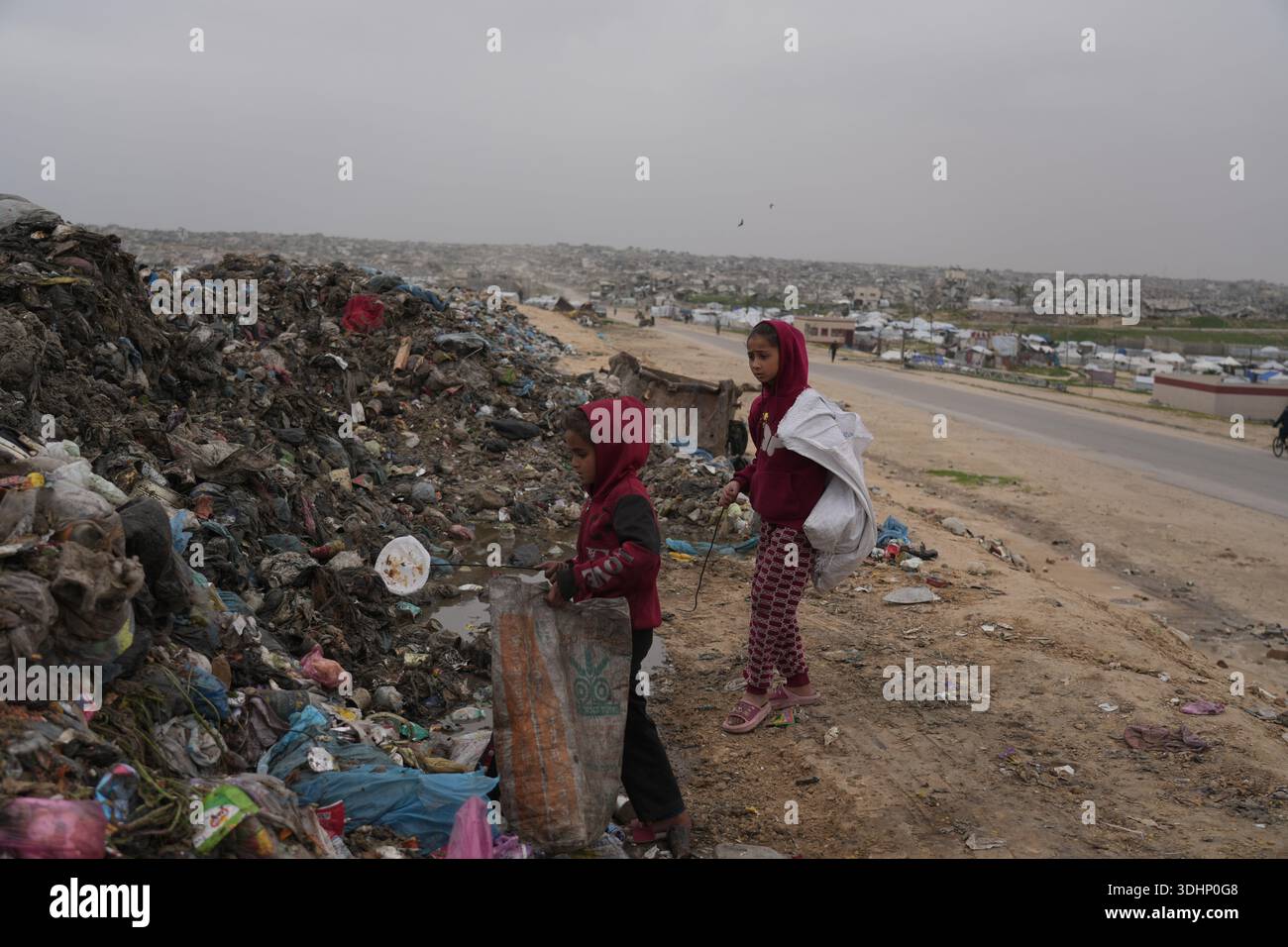 Palestinian girls Jana Al-Basouni and Lina Hamdin collect plastic and ...