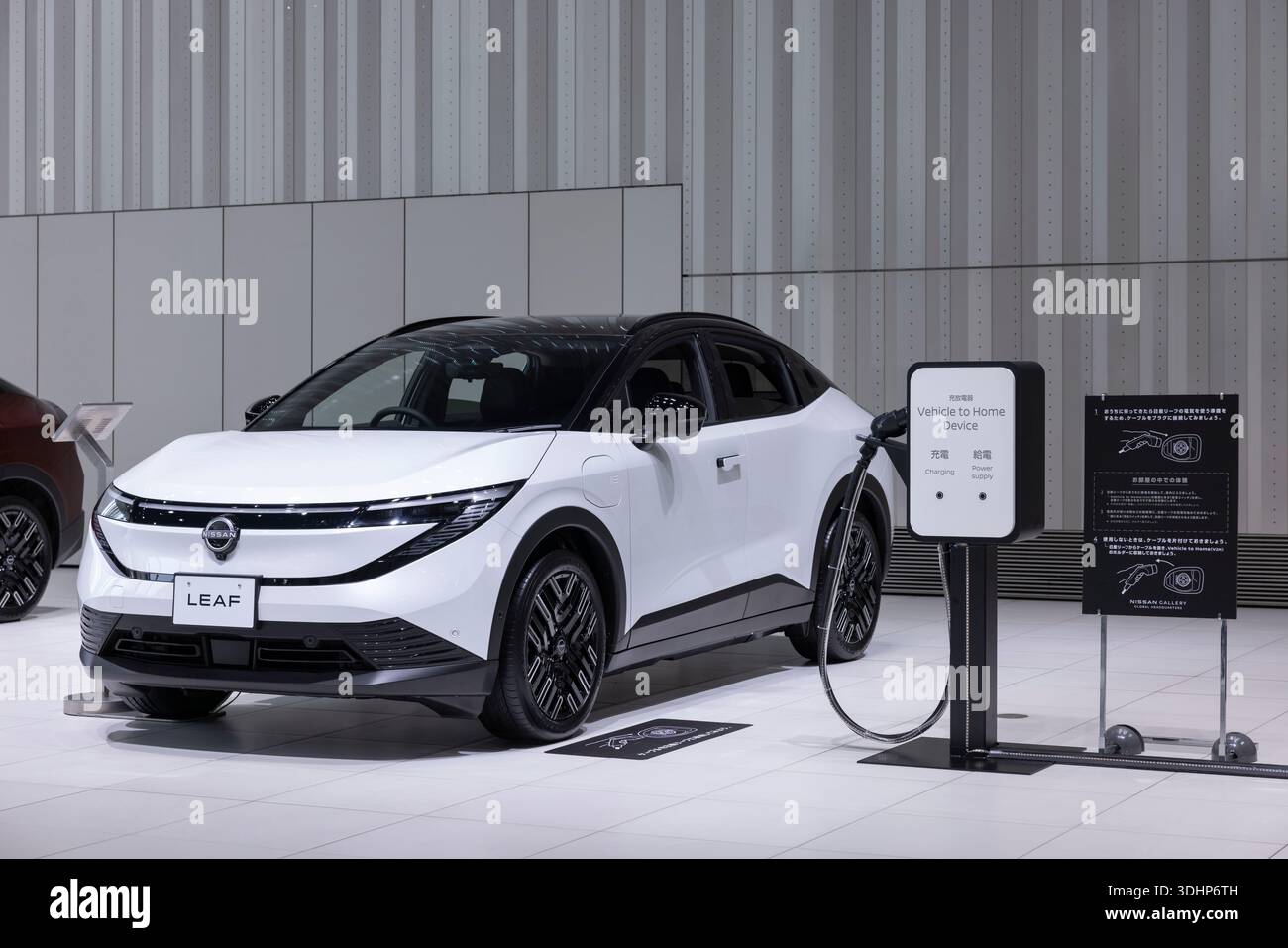 Nissan's vehicle to home charging device on display inside Nissan ...