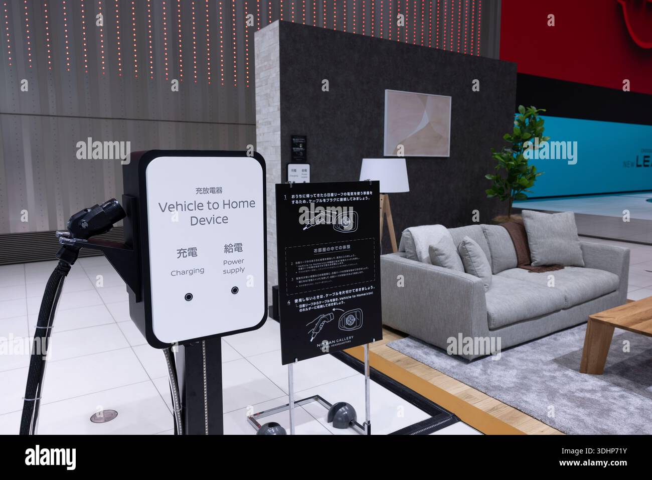 Nissan's vehicle to home charging device on display inside Nissan ...