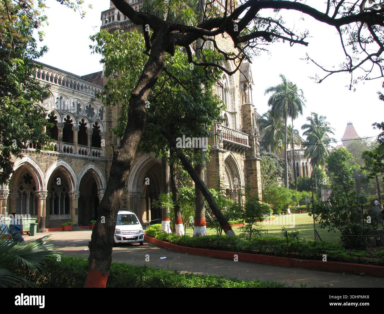 Historic Bombay High Court building surrounded by trees and gardens in ...