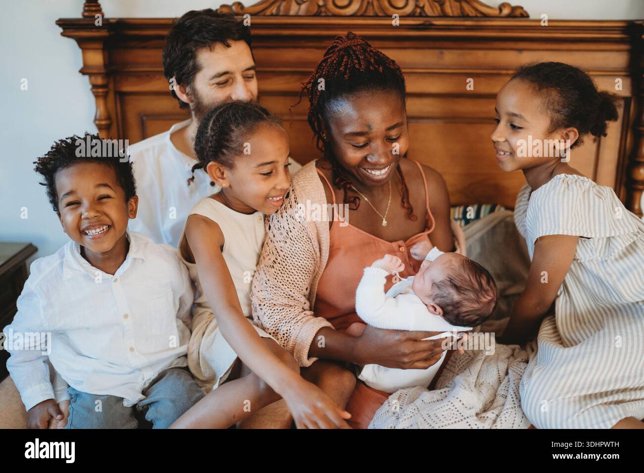 Large Multiracial family black mom white dad holding newborn Stock ...