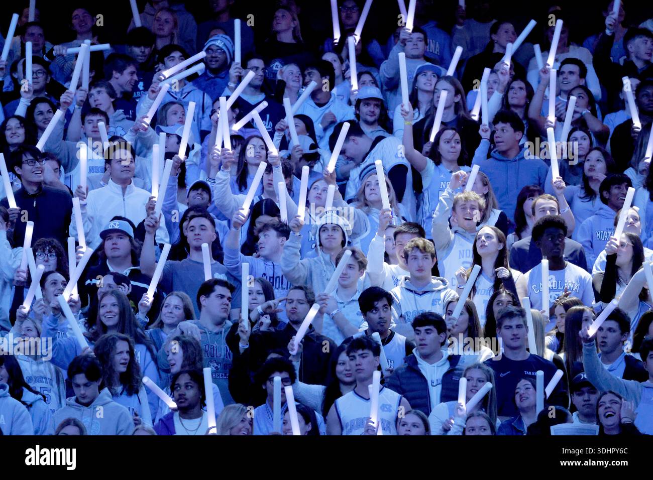 North Carolina fans wave light sticks before the start of an NCAA ...