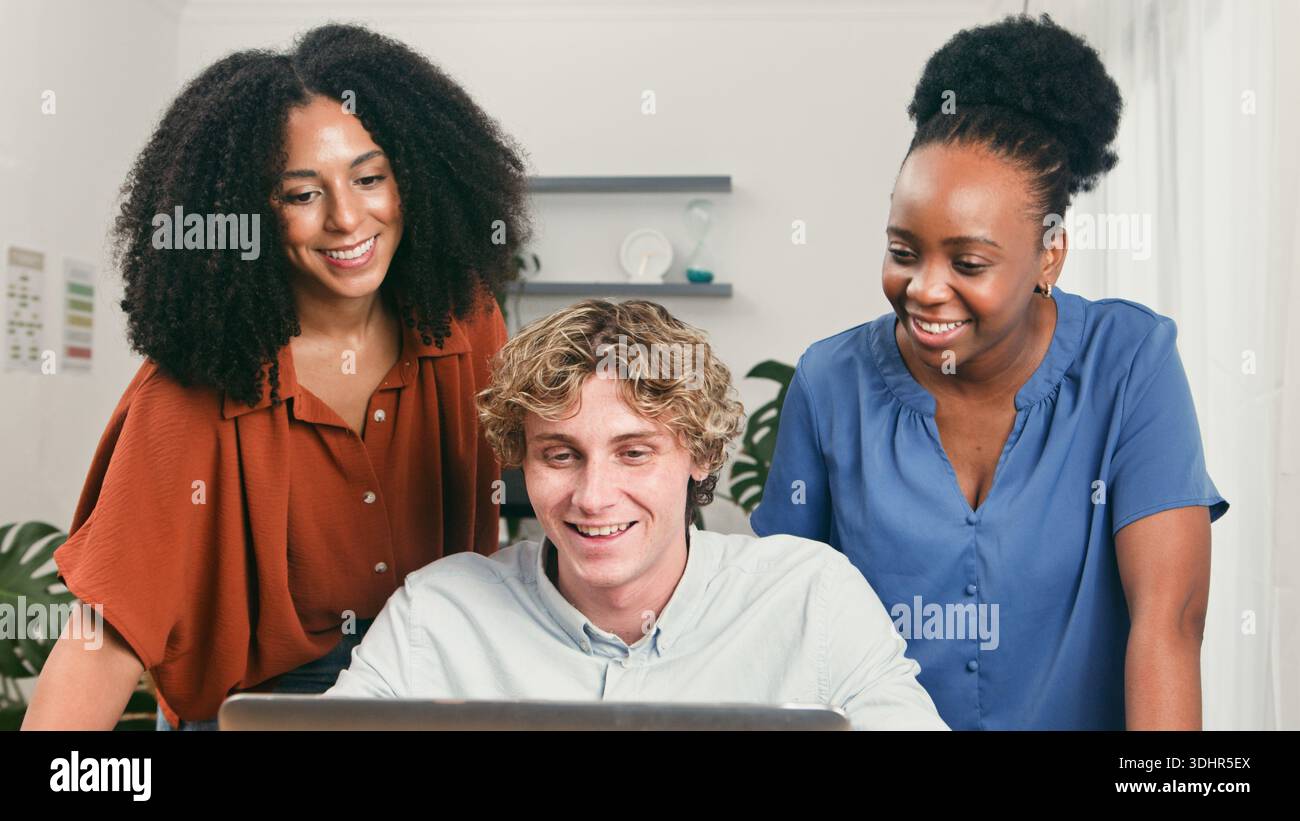 Three Friends Collaborate On Laptop In Bright Office, Startup Team ...