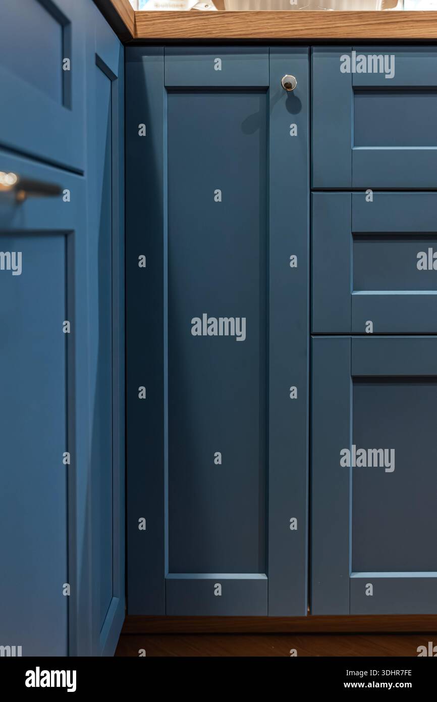 Blue kitchen drawers opened for smart storage. Open drawers Stock Photo ...