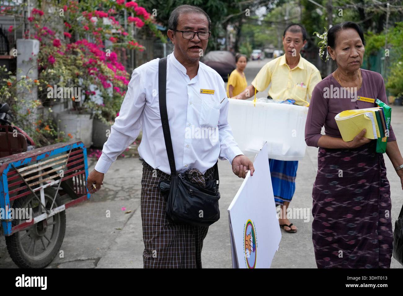 Members and volunteers of Union Election Commission walk to collect ...