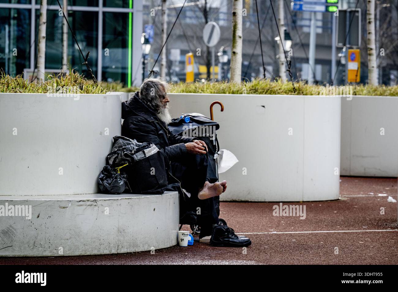 THE HAGUE - A man sits on a bench in the hedge ROBIN UTRECHT/ ANP ...