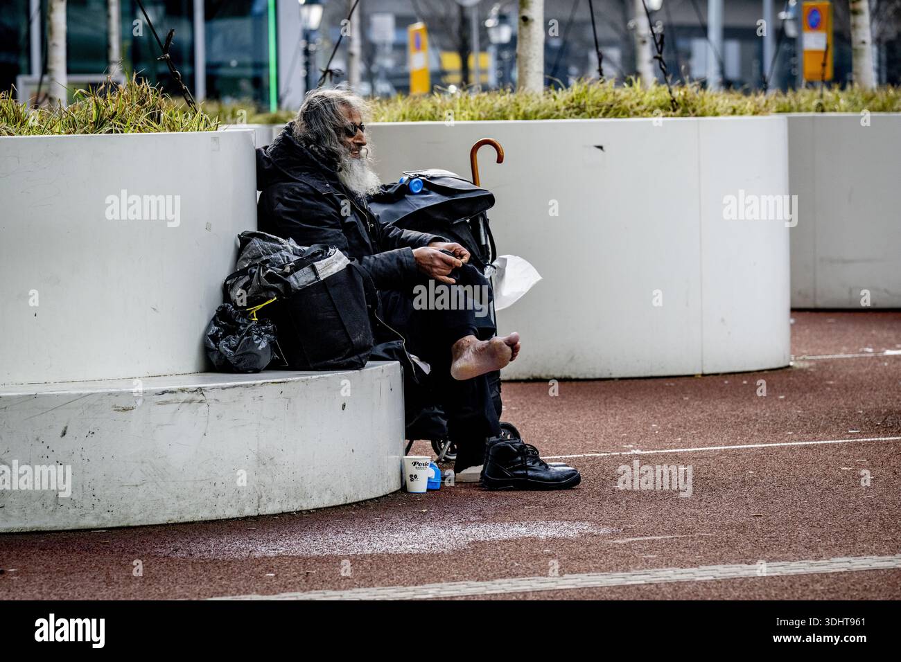 THE HAGUE - A man sits on a bench in the hedge ROBIN UTRECHT/ ANP ...