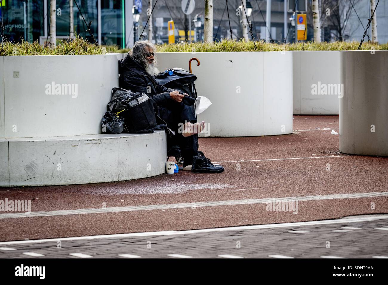 THE HAGUE - A man sits on a bench in the hedge ROBIN UTRECHT/ ANP ...