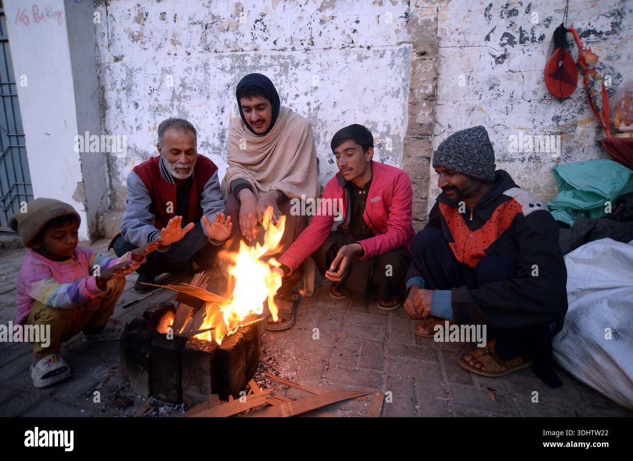 People are warming their hands on bone-fire to save themselves from ...