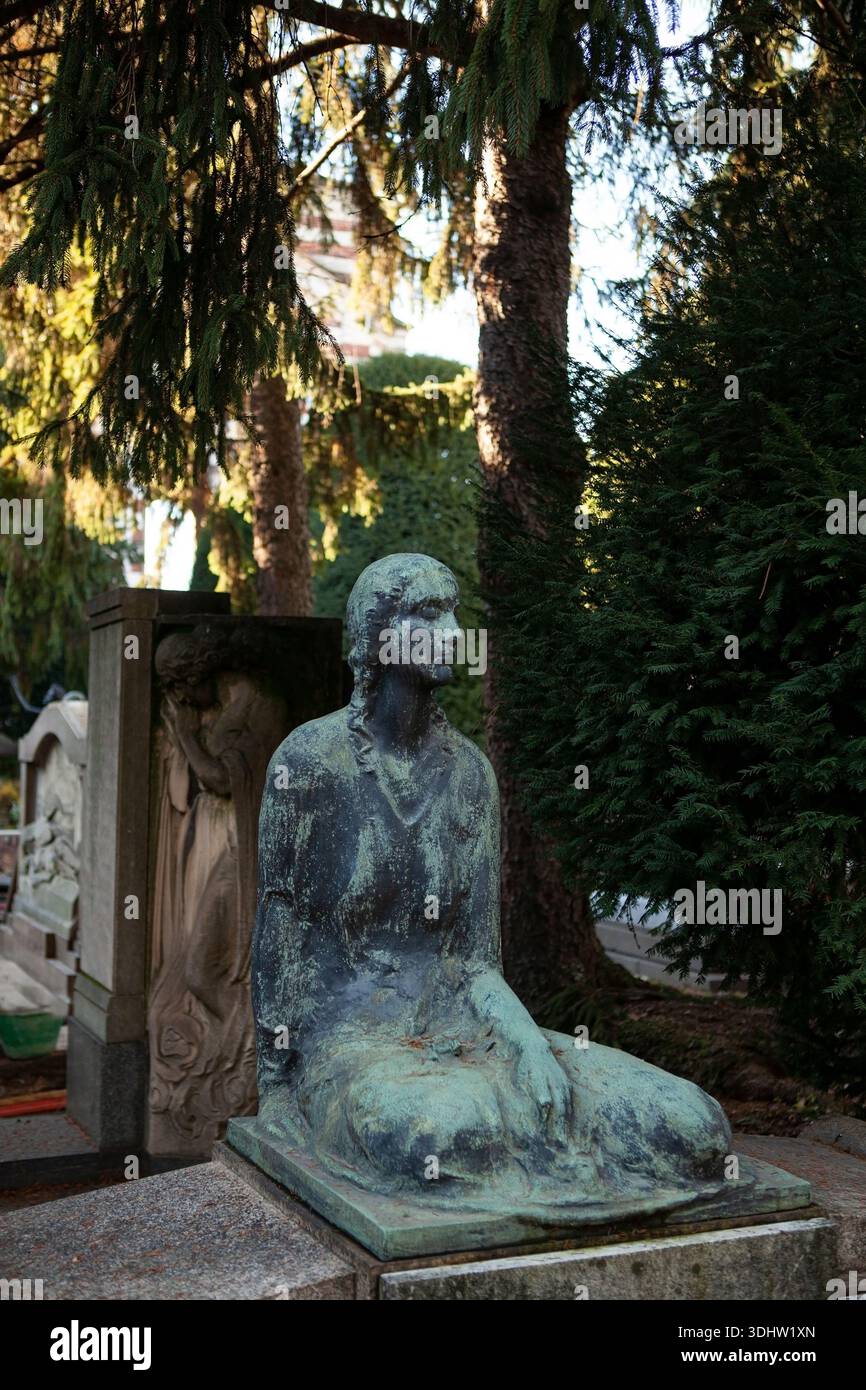 Milan, Italy - December 2021: Verdigris bronze statue of a woman in a ...