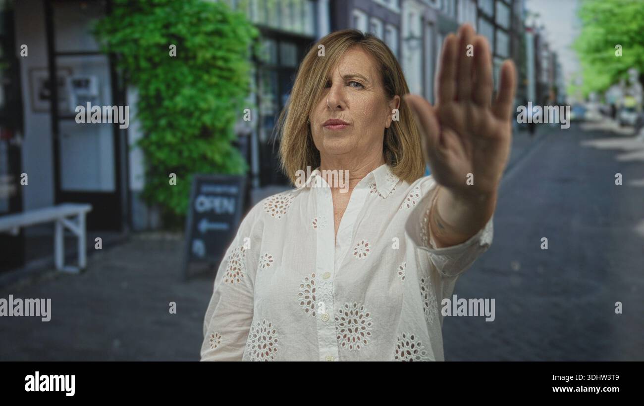 Mature woman protester holds hi-res stock photography and images - Alamy