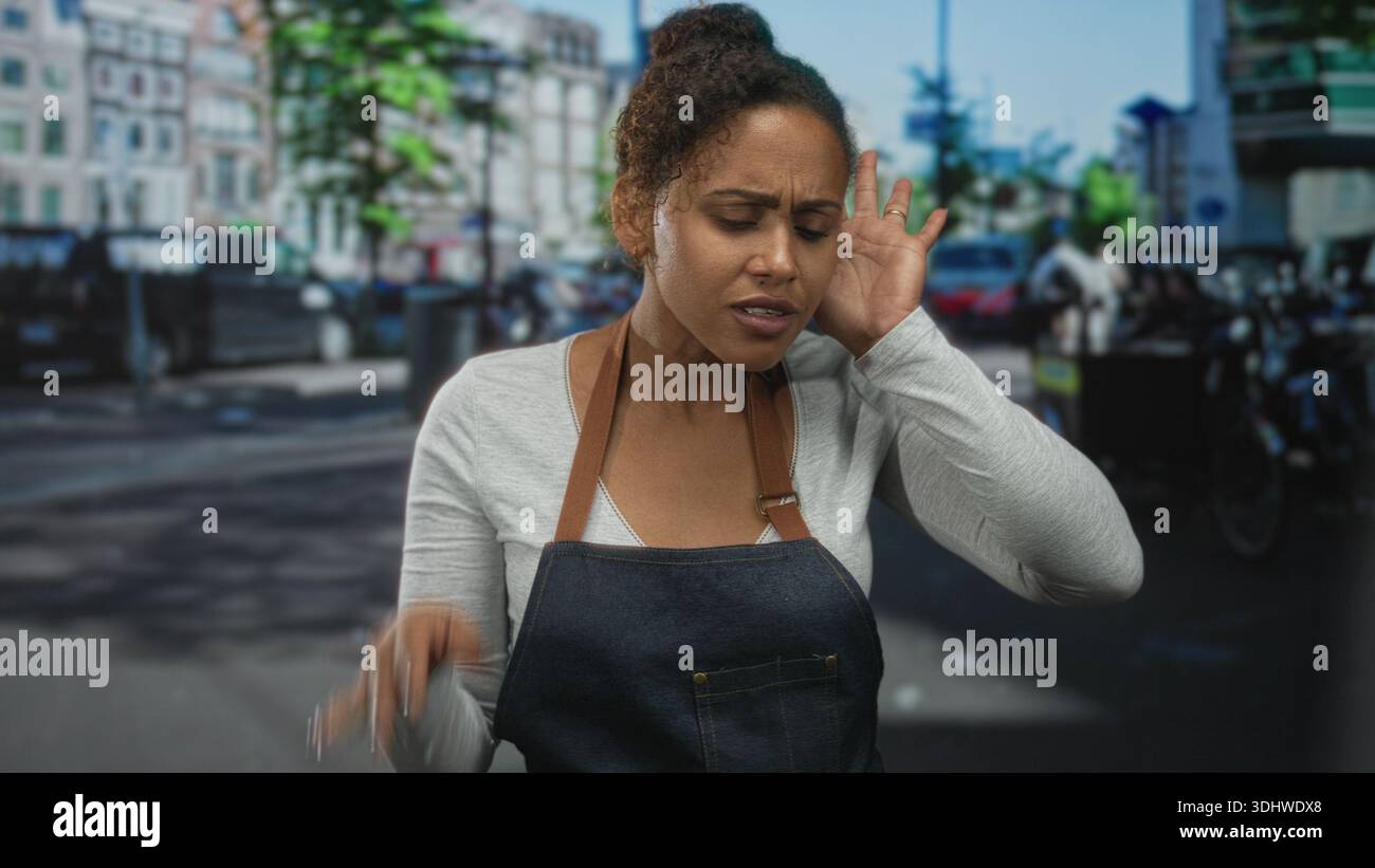 Woman cupping ear hand furrowed hi-res stock photography and images - Alamy