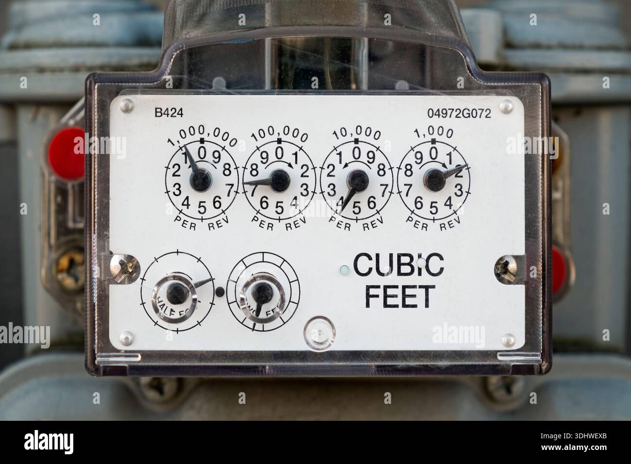 Detailed view of a natural gas meter with dials measuring cubic feet of ...