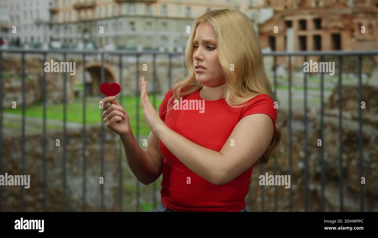 Woman rejecting heart symbol hi-res stock photography and images - Alamy