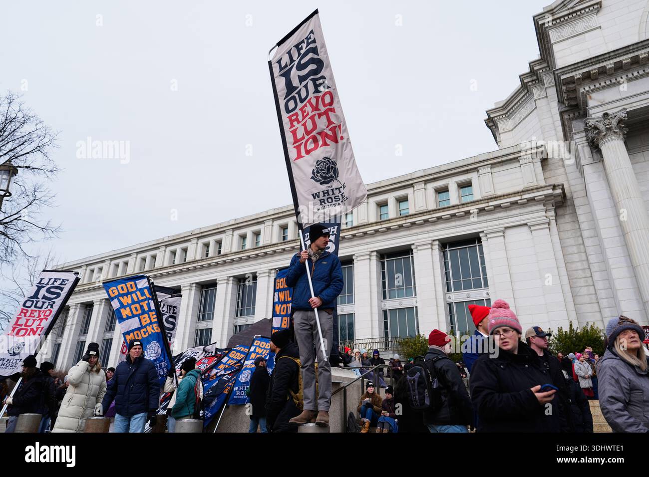 A member of The White Rose Resistance waves a flag during a rally ...