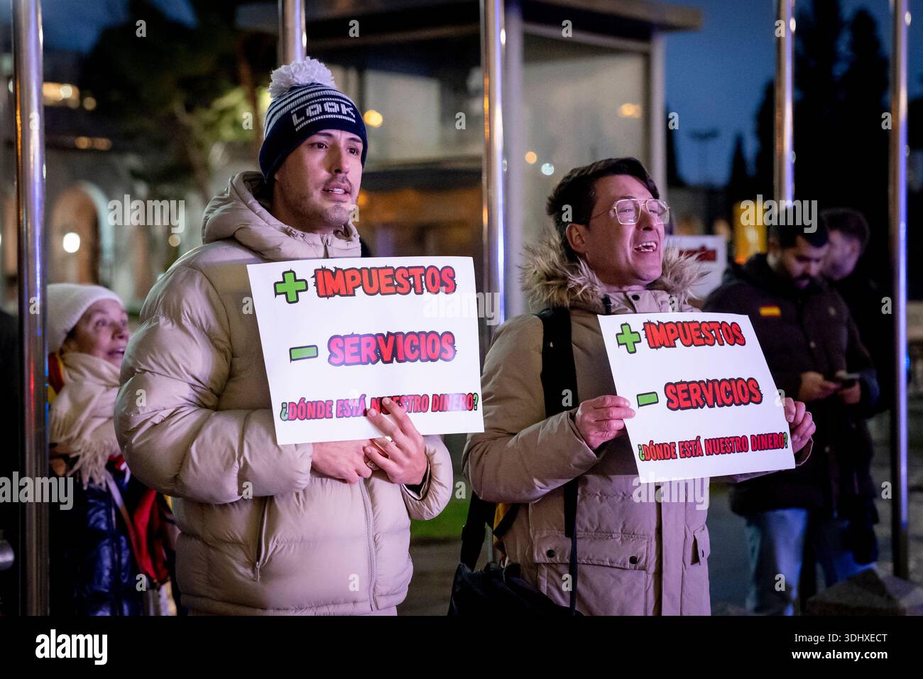 Demonstrators carry banners with the slogan '+ taxes, - services ...