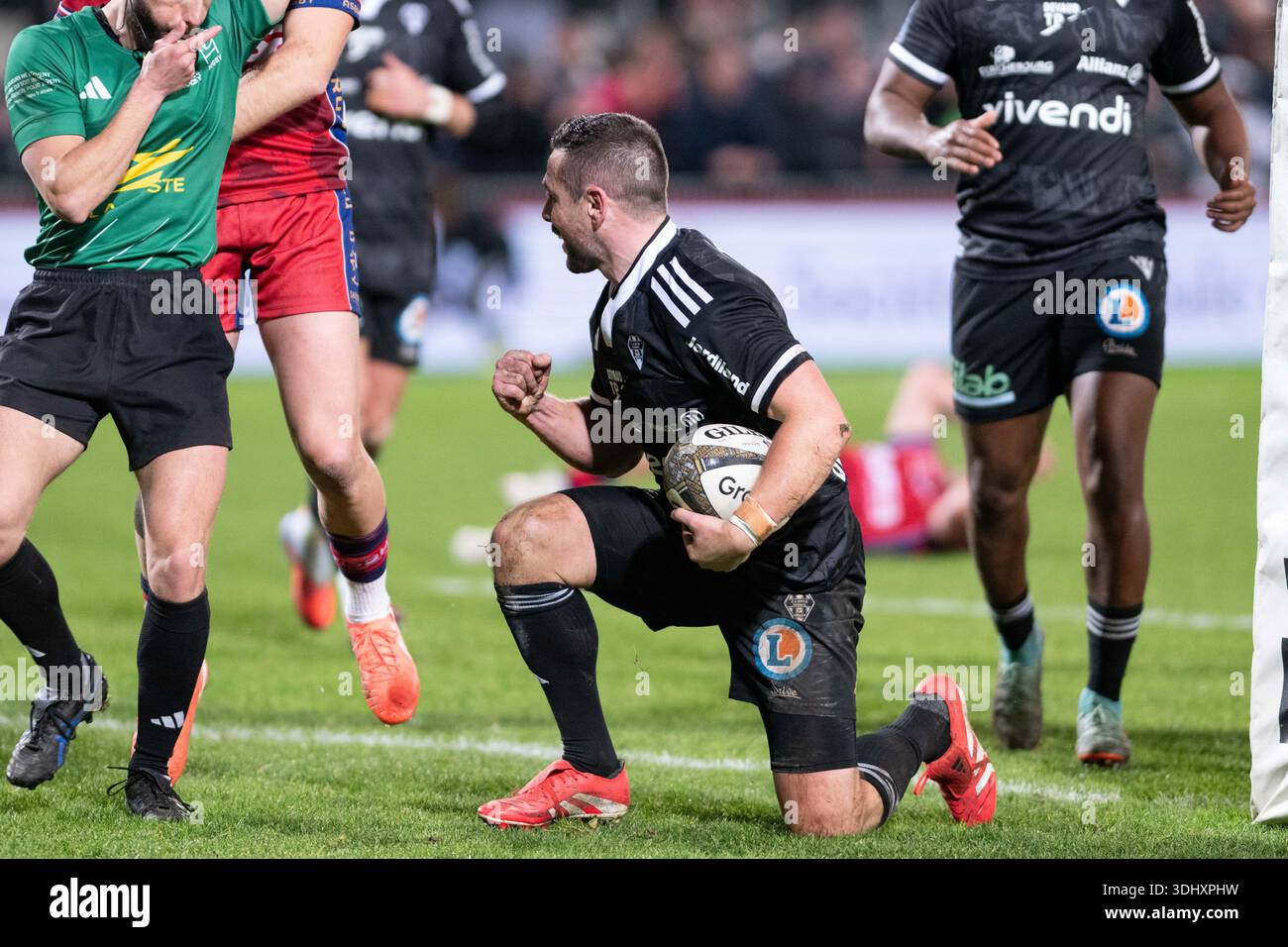 John Cooney of Brive celebrates his try during the Pro D2 match between ...