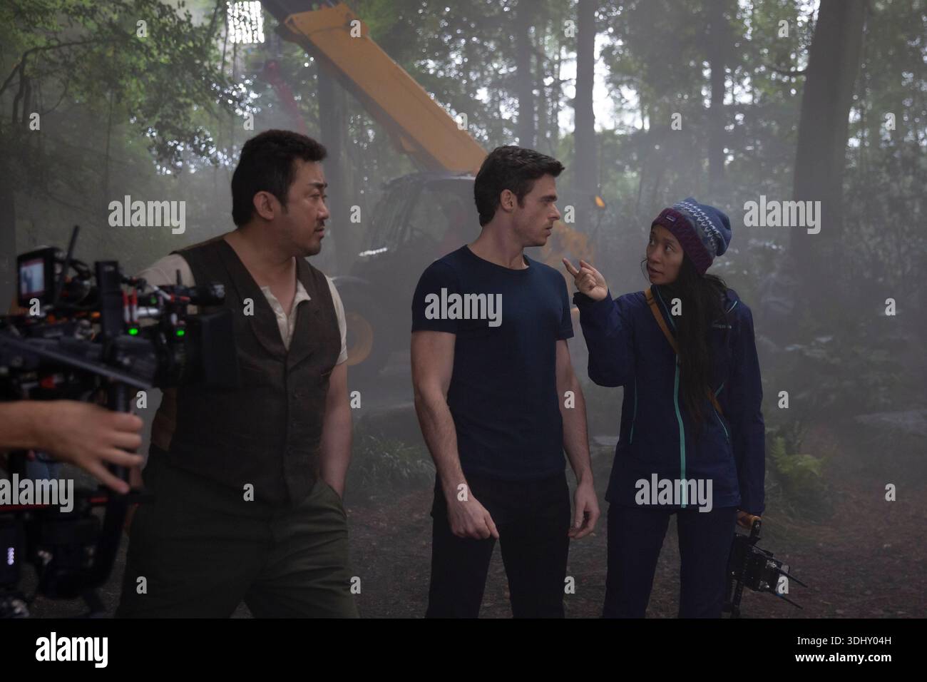 Don Lee, Richard Madden and director Chloé Zhao behind the scenes of ...