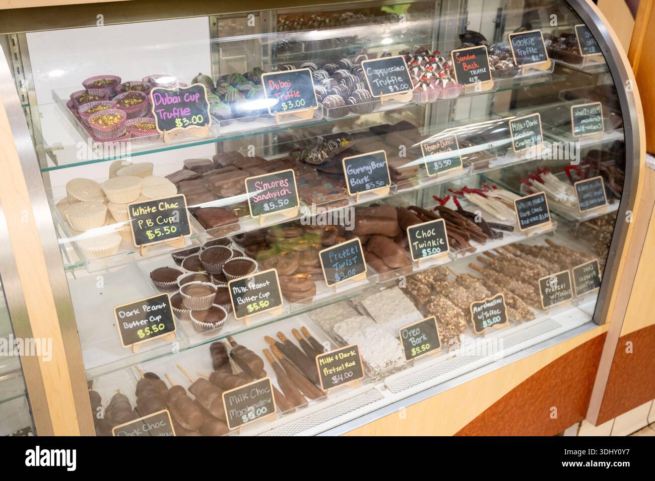 Display case with chocolates at Too Sweet candy store, Newport Beach ...