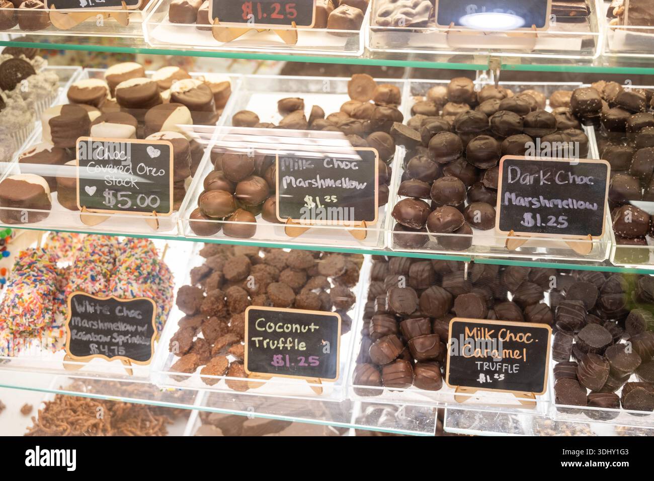Display case with chocolates at Too Sweet candy store, Newport Beach ...