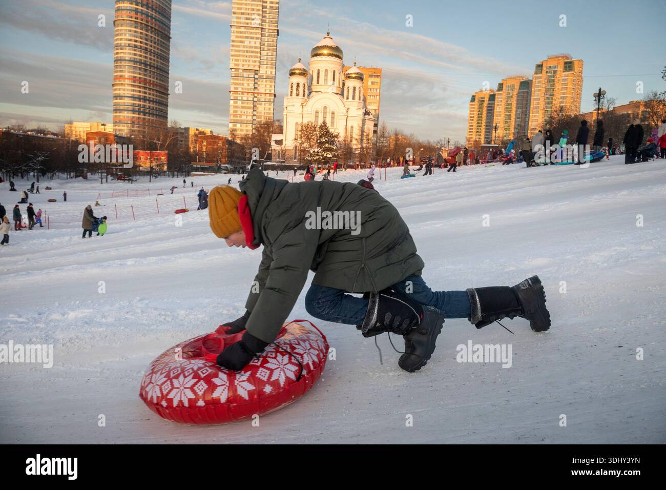 Moscow, Russia. 18th January, 2026. Young people go sledding on an ...
