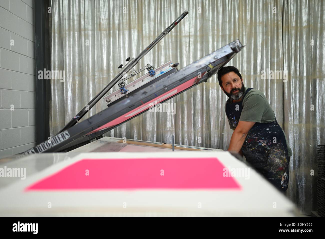 Artist and printer Trent Walter poses for a photograph at Negative ...