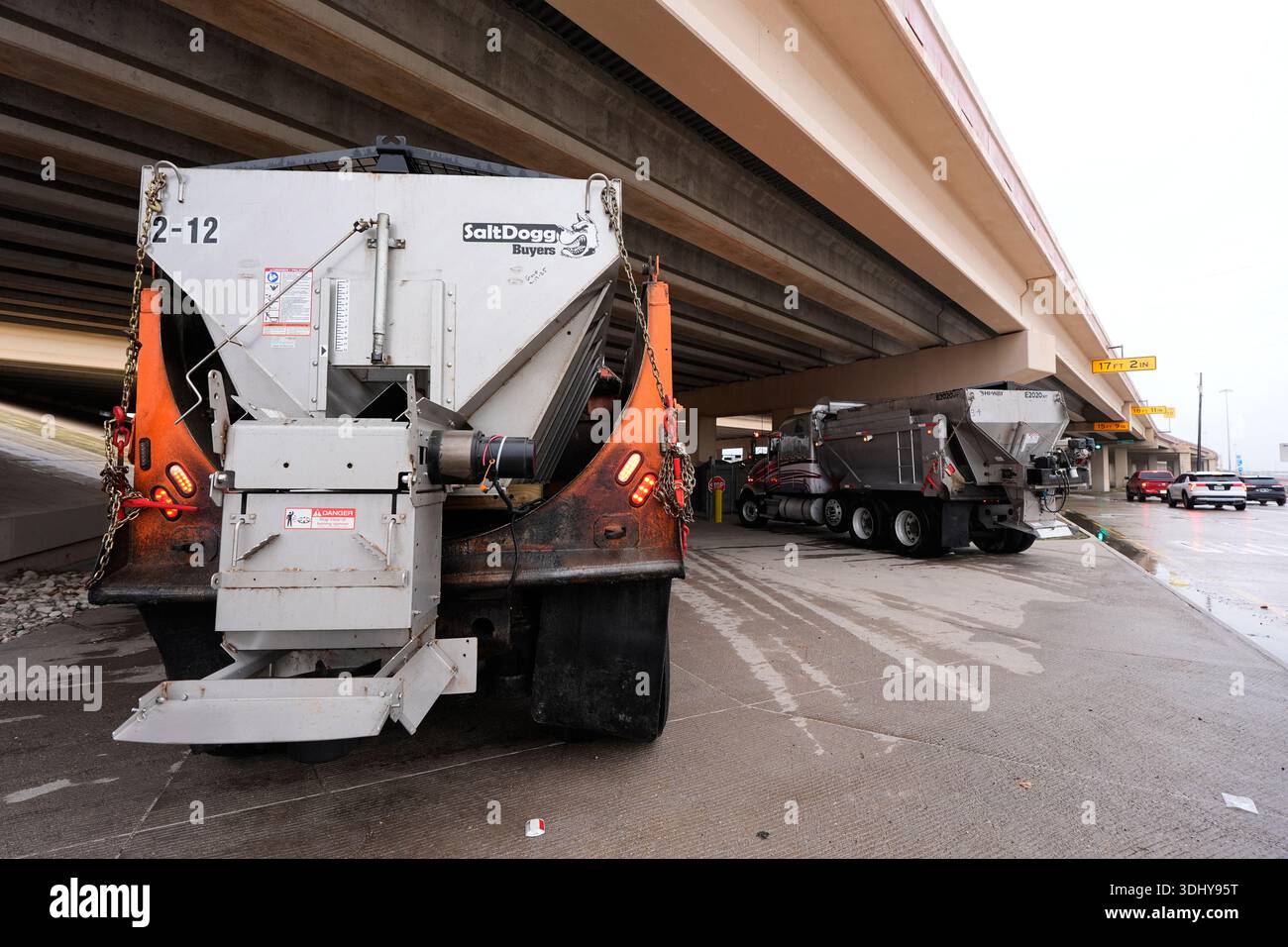 Work crews in their trucks line up beneath the President George Bush ...