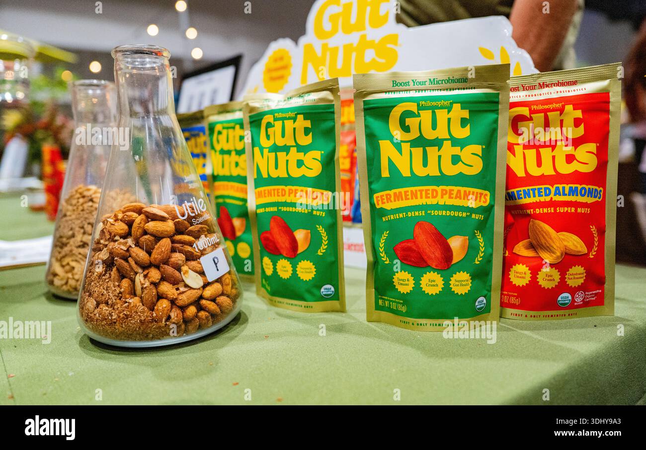 Close up display of Gut Nuts fermented peanuts and branded packaging at ...