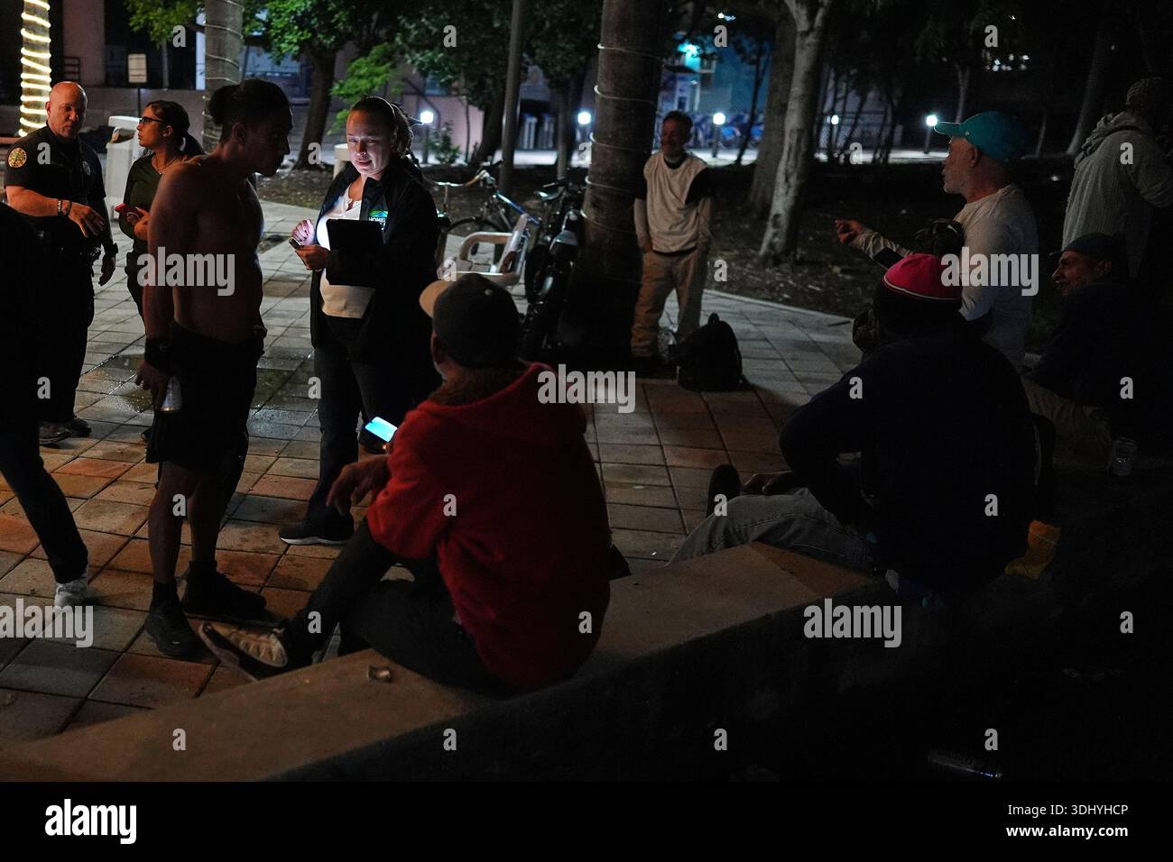 Katherine Martinez, center left, of the City of Miami Homeless ...