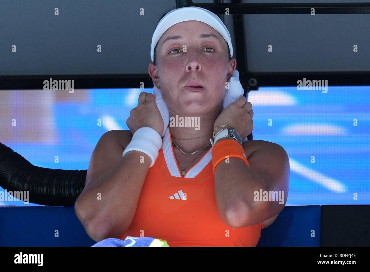 Jessica Pegula of the U.S. places a cold towel on her face during her ...
