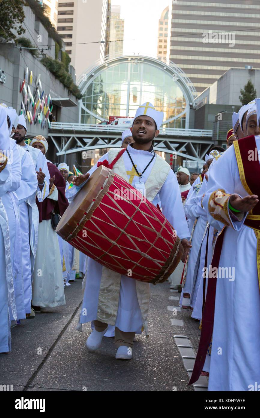 A congregant plays a traditional kebero drum during a procession ...