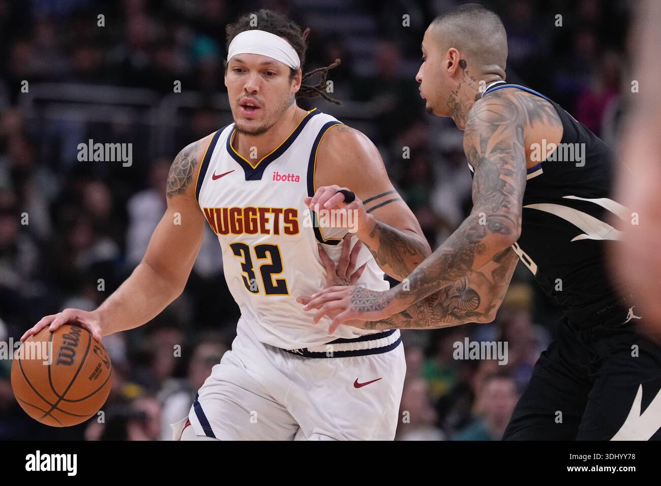 Denver Nuggets' Aaron Gordon tries to get past Milwaukee Bucks' Kyle ...