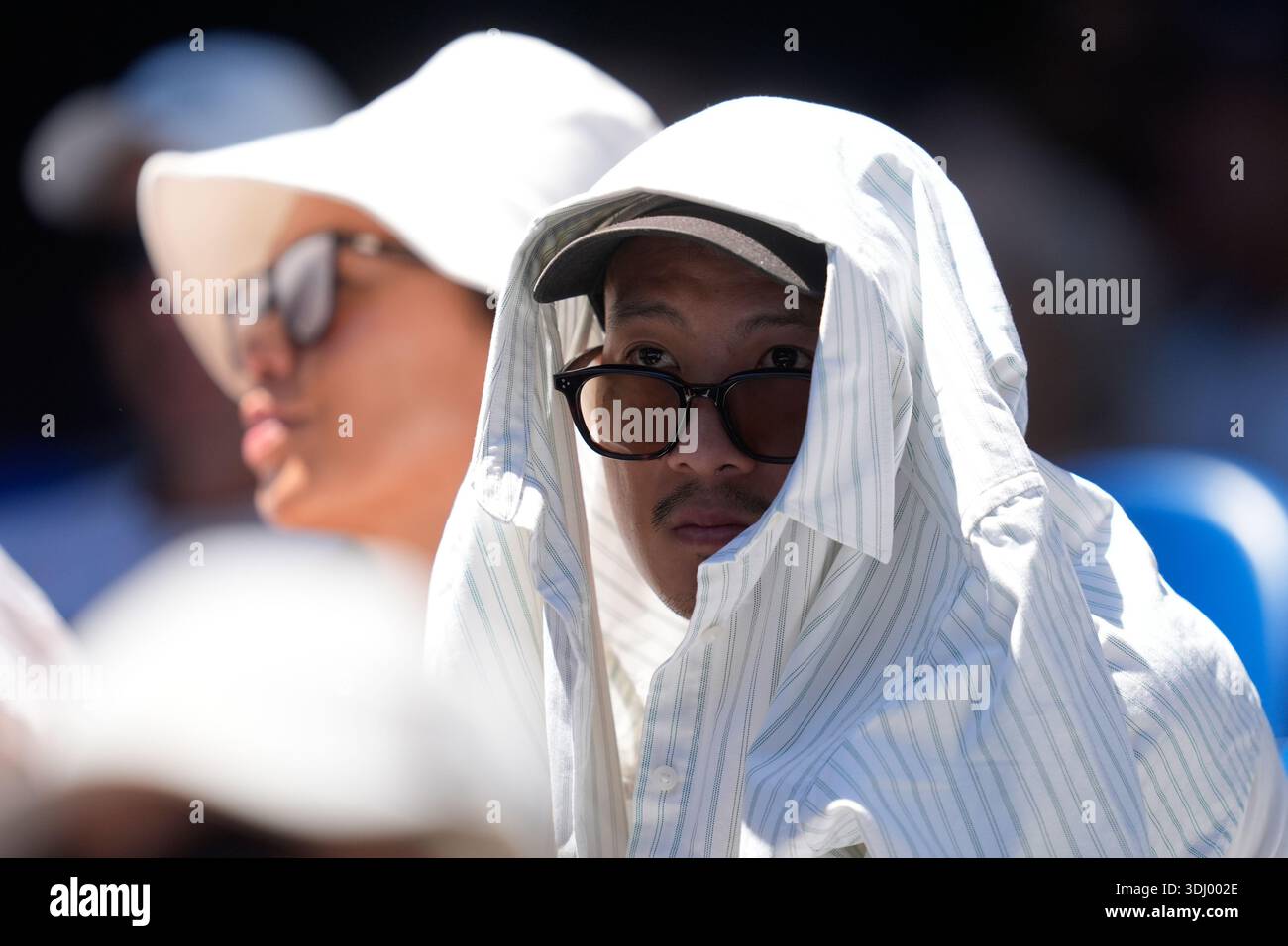 Spectators watch third round matches at the Australian Open tennis ...