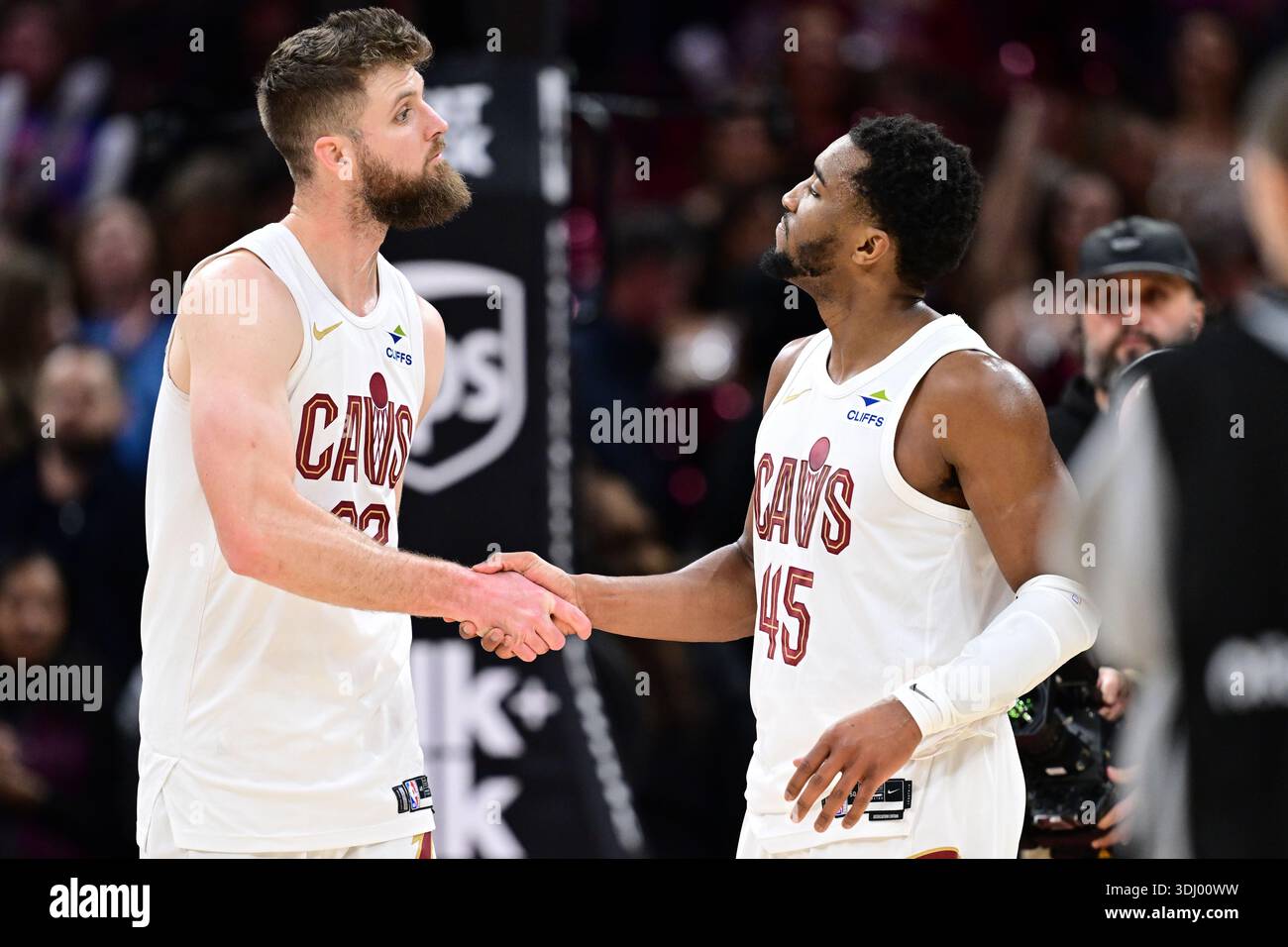 Cleveland Cavaliers guard Donovan Mitchell, right, shakes hands with ...