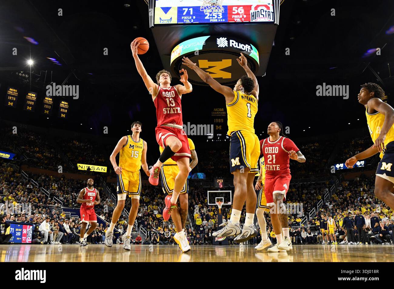Ohio State center Christoph Tilly (13) goes up to shoot next to ...