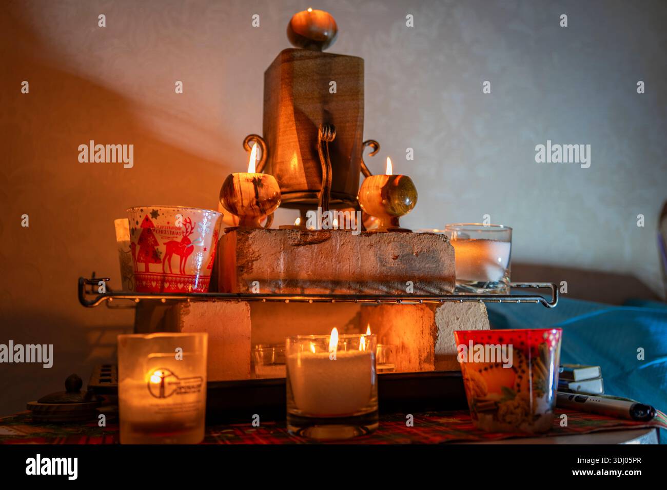 An improvised "fireplace" made of bricks and candles in an apartment on ...