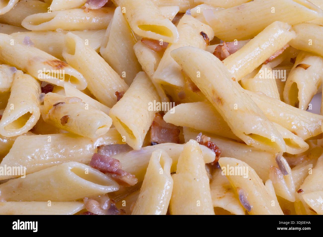 Savory pasta dish, Rich penne with crispy bacon, Creamy pasta topped ...