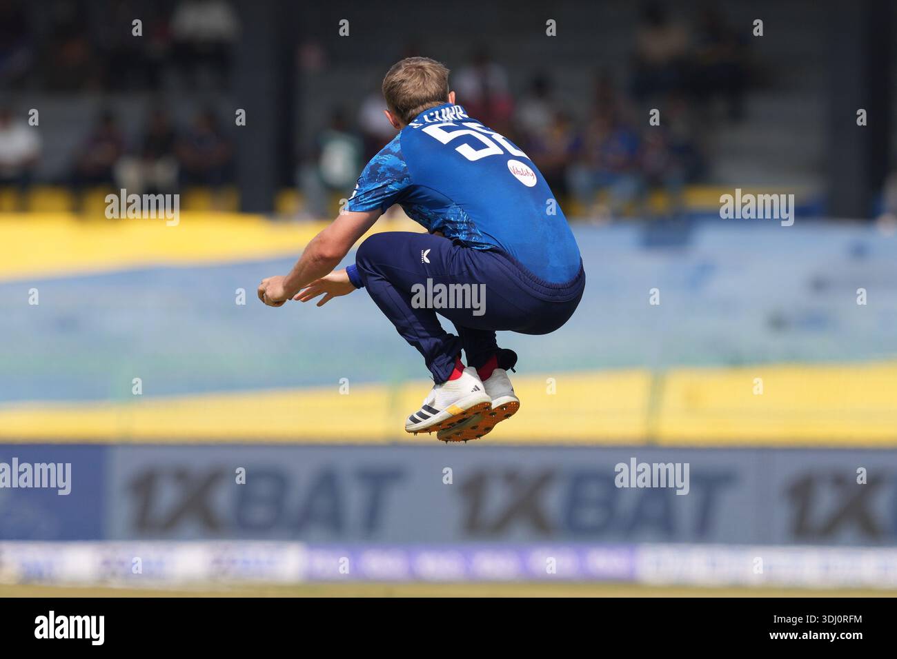 England's Sam Curran jumps as he prepares to bowl a delivery during the ...