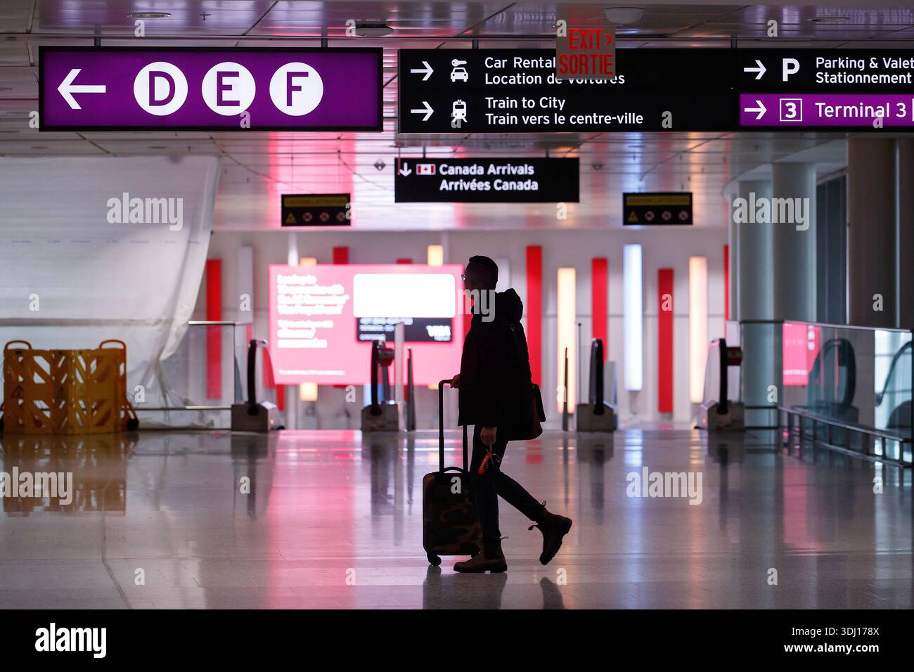 Travellers make their way through Pearson International Airport in ...