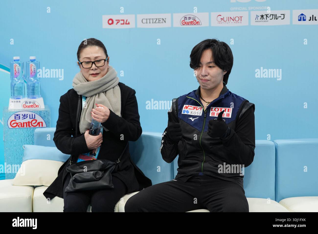 Beijing, China. 24th Jan, 2026. Kao Miura (R) of Japan reacts after the ...