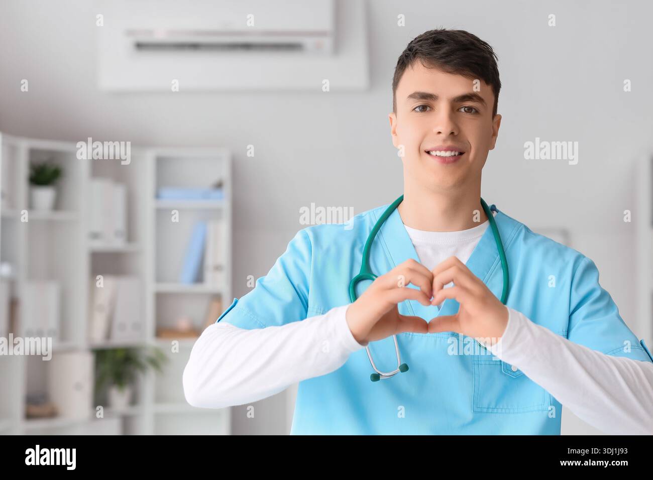 Doctor making heart gesture hi-res stock photography and images - Alamy