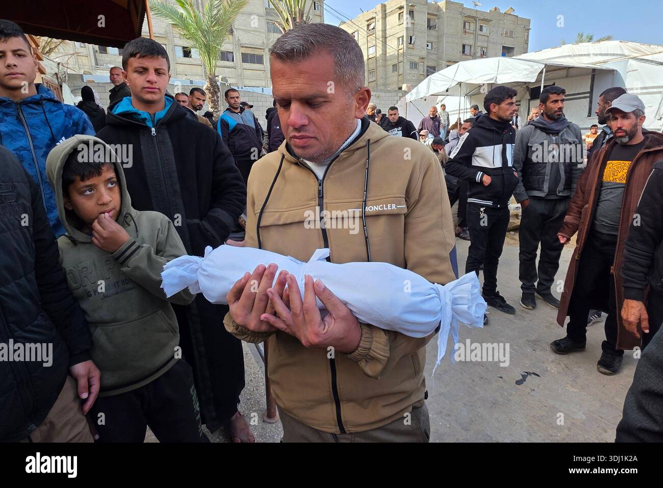 Palestinians mourn the body of infant Sajoud Alyyan at Nasser Medical ...
