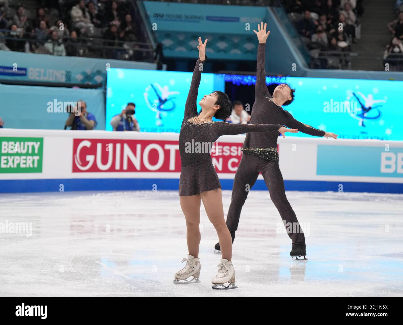 Tae Ok RYOM and Kum Chol HAN of North Korea perform in the pair's free ...
