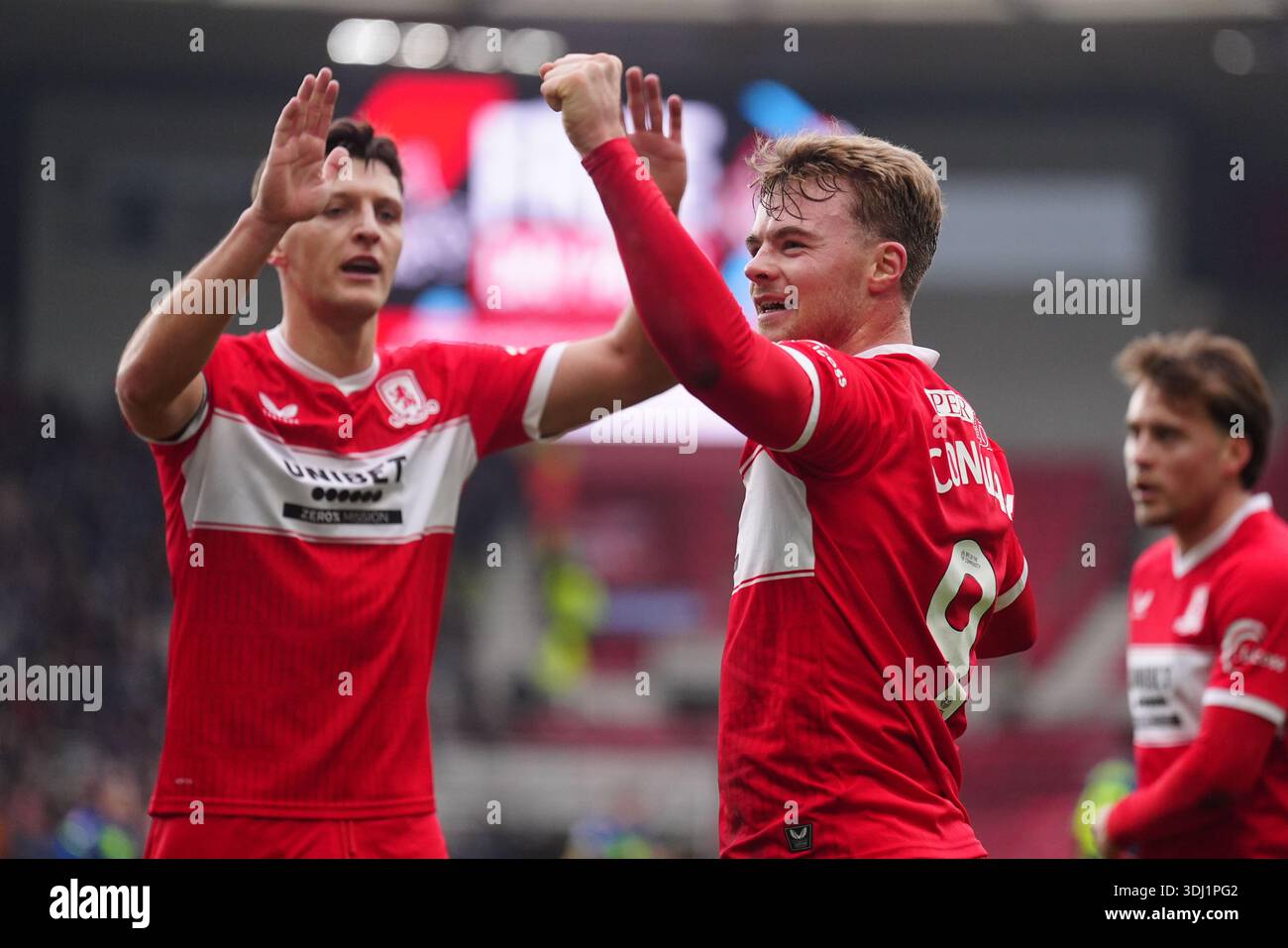 Middlesbrough's Tommy Conway (centre) celebrates scoring their side's ...