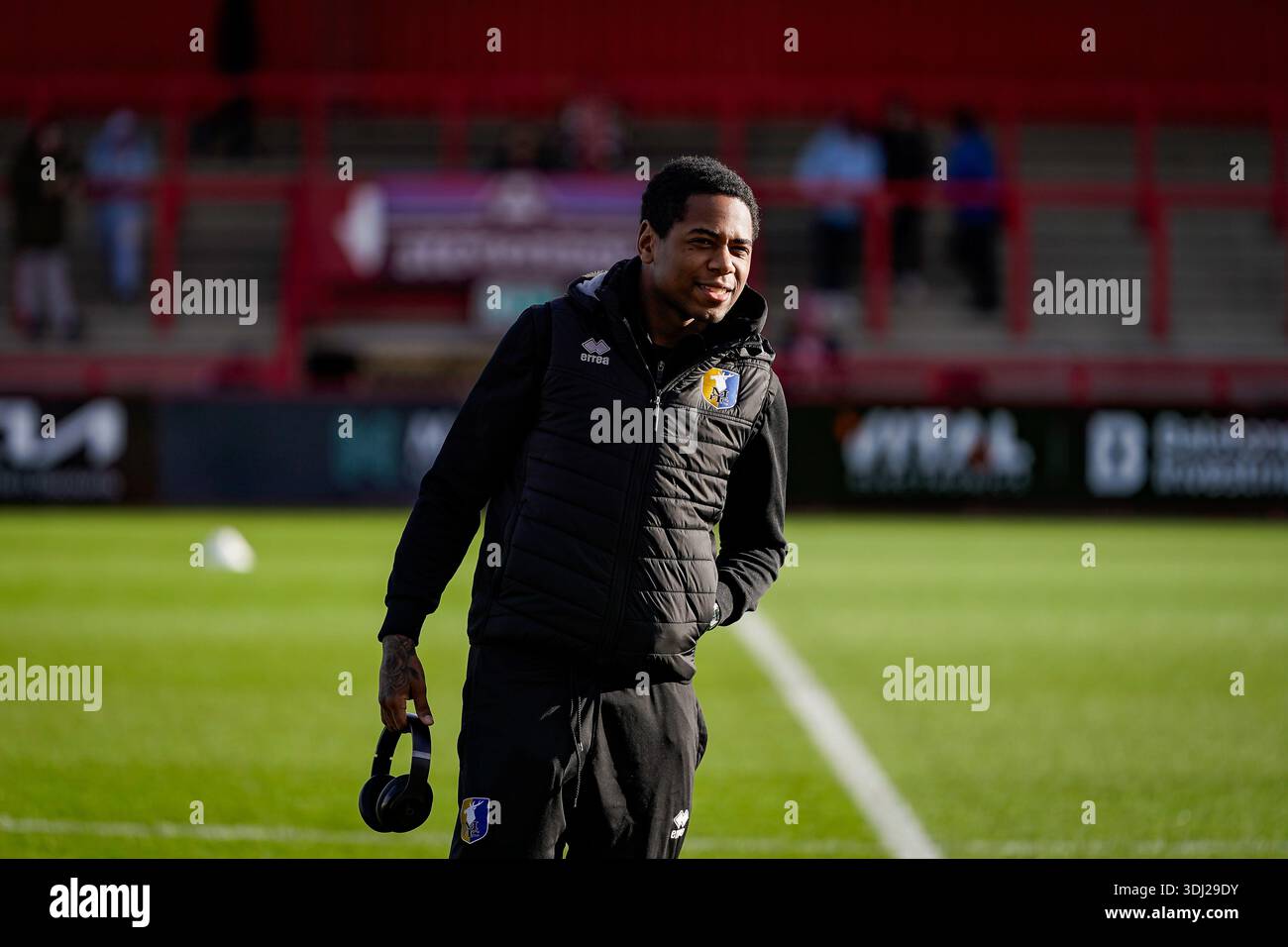 Nathan Moriah-Welsh of Mansfield Town inspects the pitch prior to kick ...