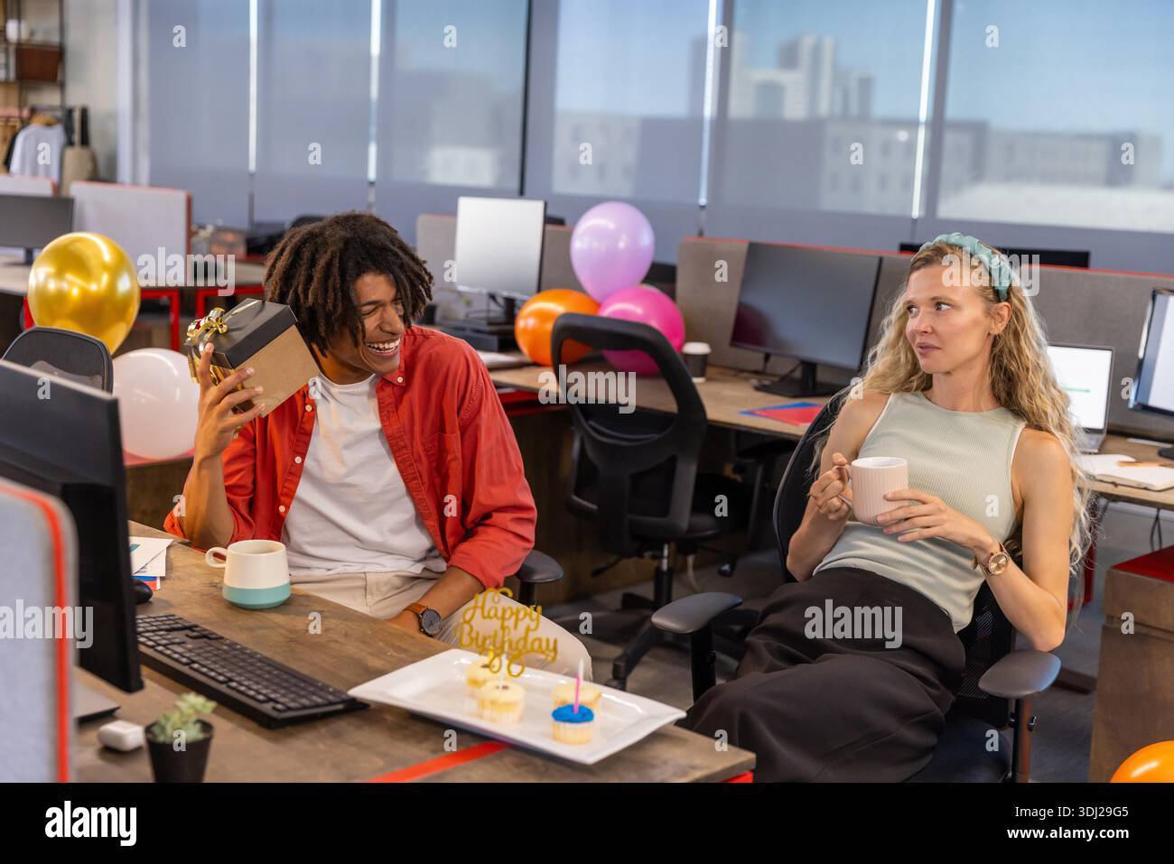 Diverse coworkers holding wrapped hi-res stock photography and images ...