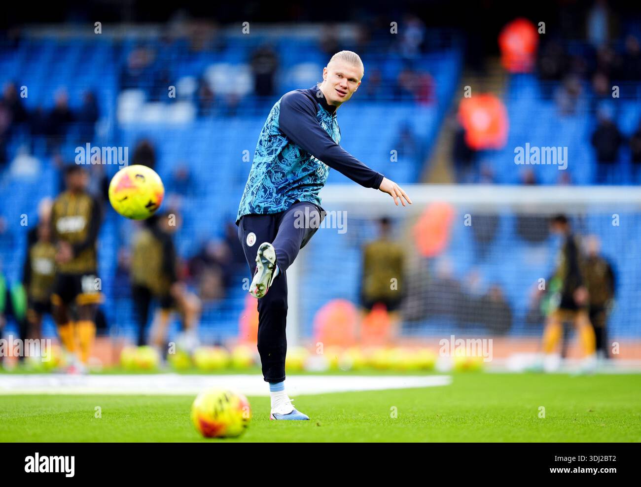 Manchester City's Erling Haaland, who starts on the bench, warms up ...