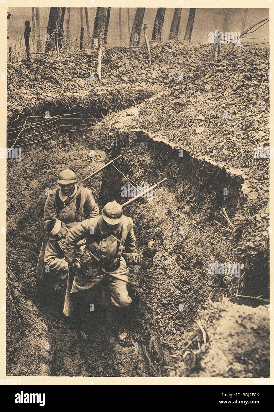 Soldiers walking in trenches carrying another wounded soldier. Archive ...