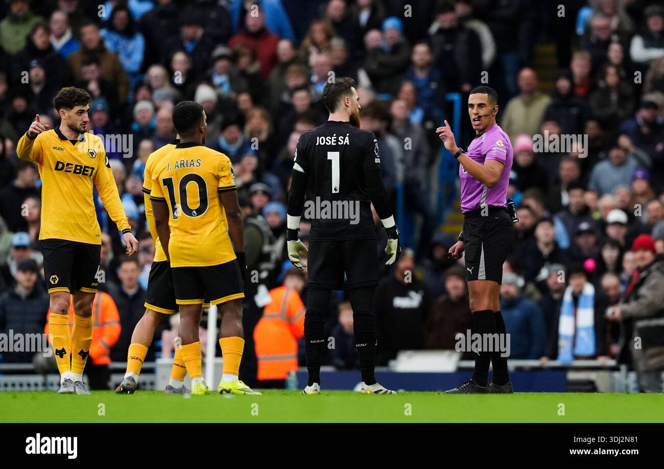 Referee Farai Hallam makes an announcement of no penalty following a ...