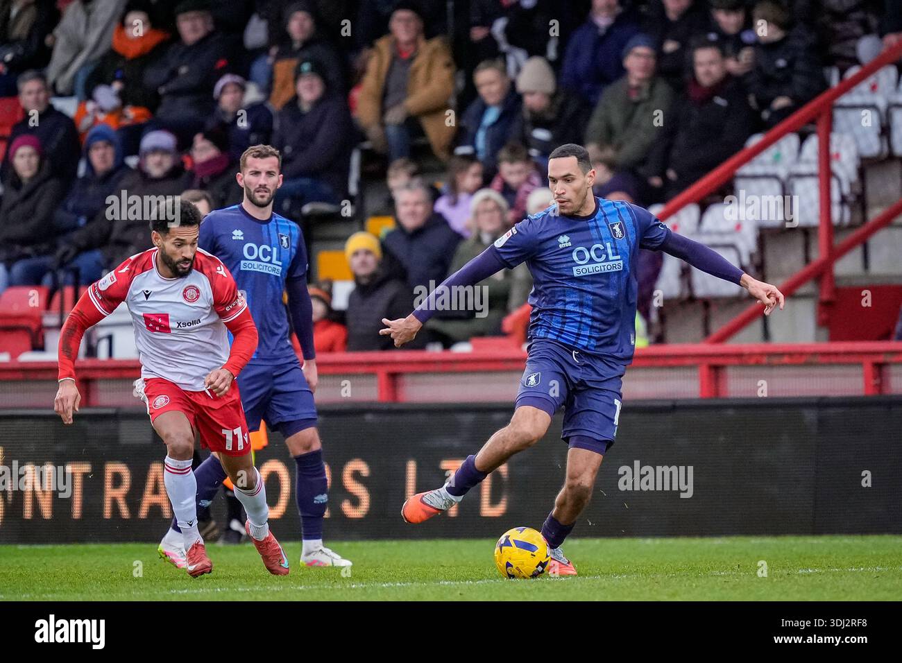 Jon Russell of Mansfield Town dribbles the ball during the Sky Bet ...